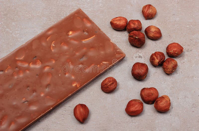 Nutritious Chocolate and Hazelnuts on Cement Structure Stock Photo ...