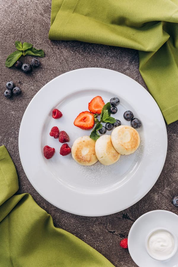 Nutritious Vegetarian Breakfast with Cheesecakes and Berries. Stock ...