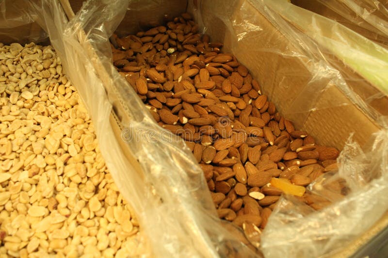 Nuts, Almonds and Peanuts in Boxes and Bags in the Store. Purchase and ...