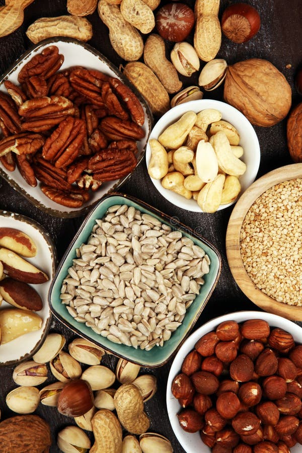 Nuts Composition on Rustic Table with Walnut and Peanut. Stock Image ...