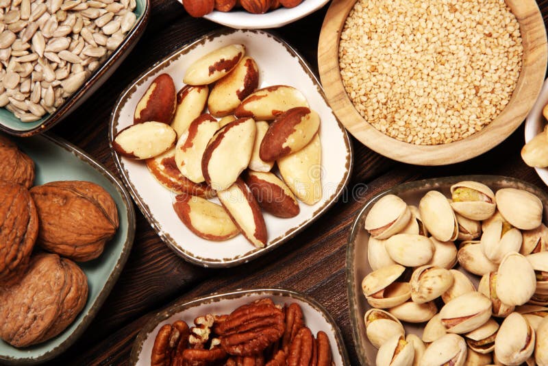 Nuts Composition on Rustic Table with Walnut and Peanut. Stock Image ...
