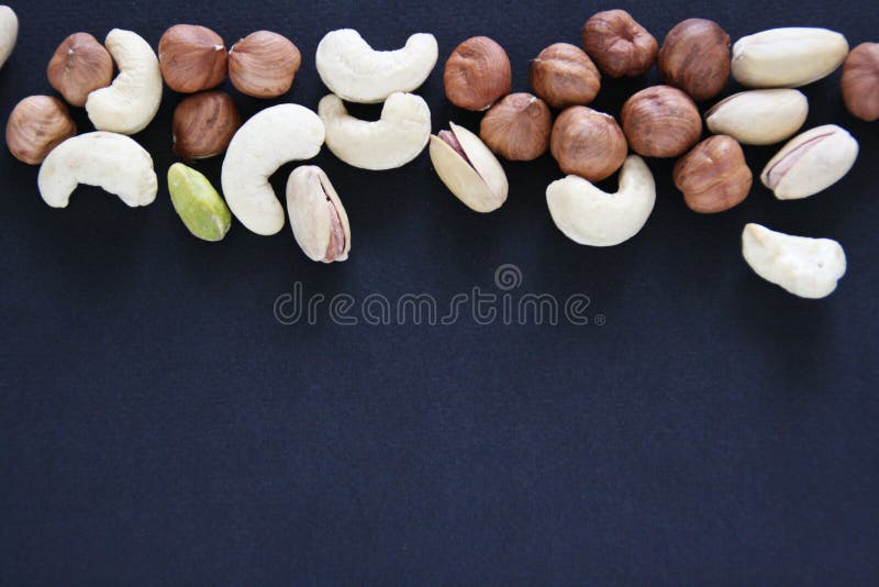 Nuts on Dark Background, Top View with Copyspace. Stock Photo - Image ...