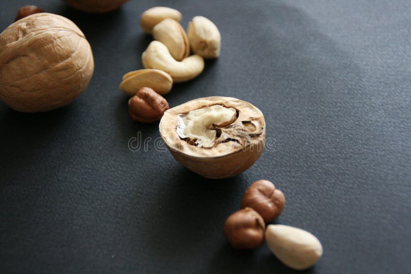Nuts on Dark Background, Top View with Copyspace. Stock Photo - Image ...