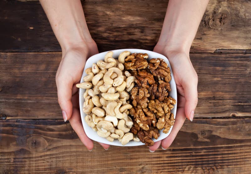 Nuts in hands stock image. Image of plate, heart, food - 90247433