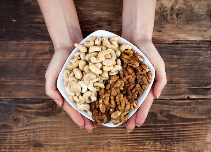 Nuts in hands stock image. Image of heart, cashew, brown - 90247441