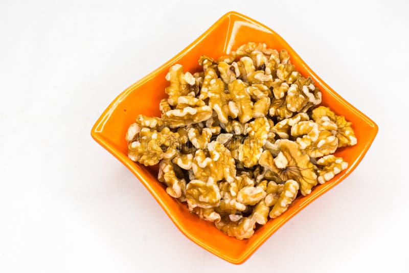 Nuts in Orange Bowl Isolated Stock Photo - Image of cashew, broken ...