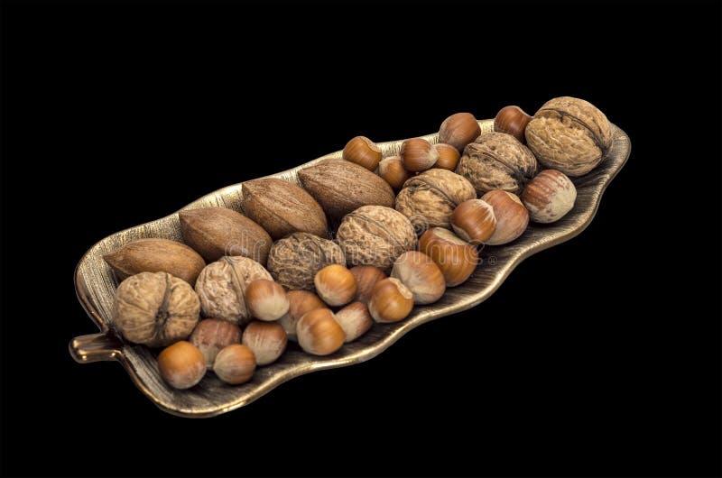 Nuts on Plate on Black Background Stock Photo - Image of close, serving ...