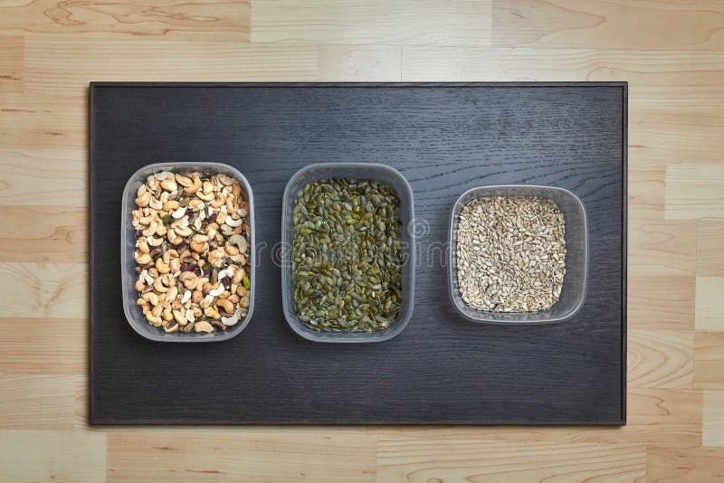 Nuts and seed in boxes stock image. Image of diet, pantry - 164254875