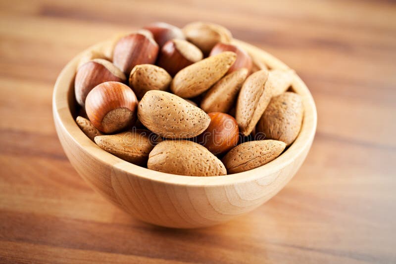 Nuts in wooden bowl stock photo. Image of nutshell, plant - 28837922