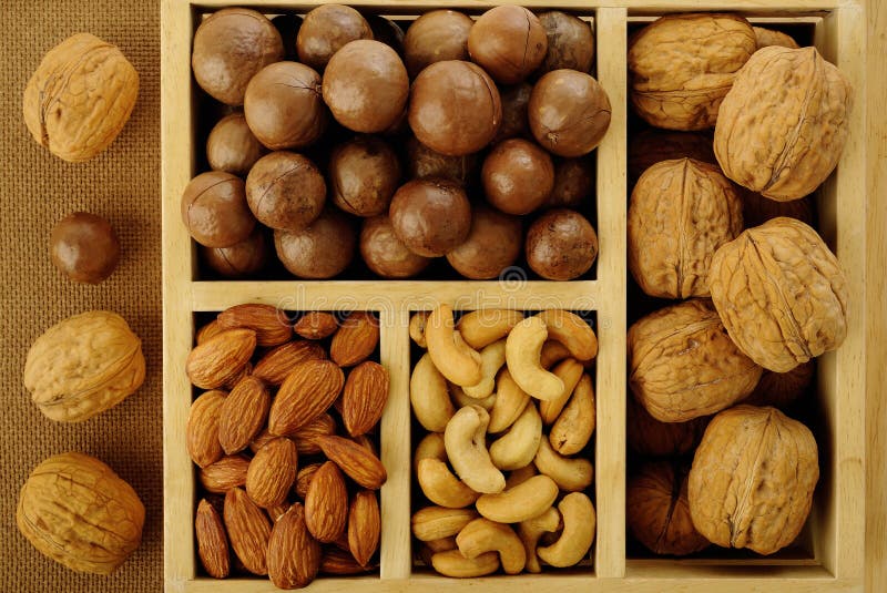 Nuts in wooden box stock photo. Image of brown, roasted - 44525830