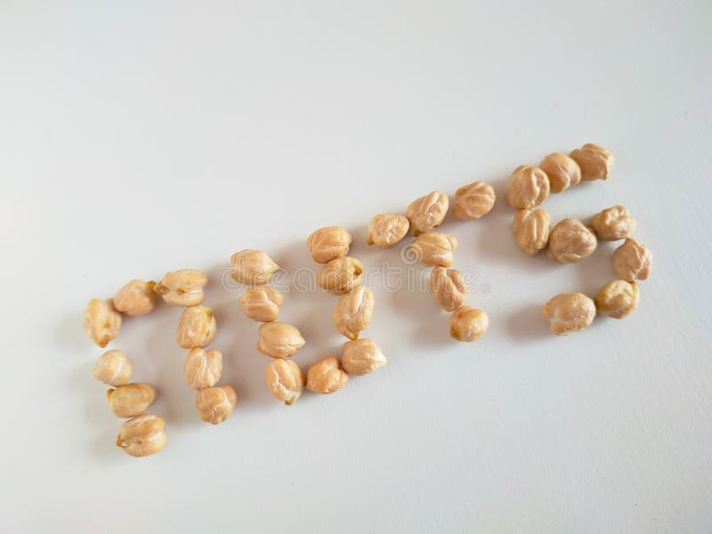 The NUTS Word with Macadamia Nuts in White Background. Stock Image ...