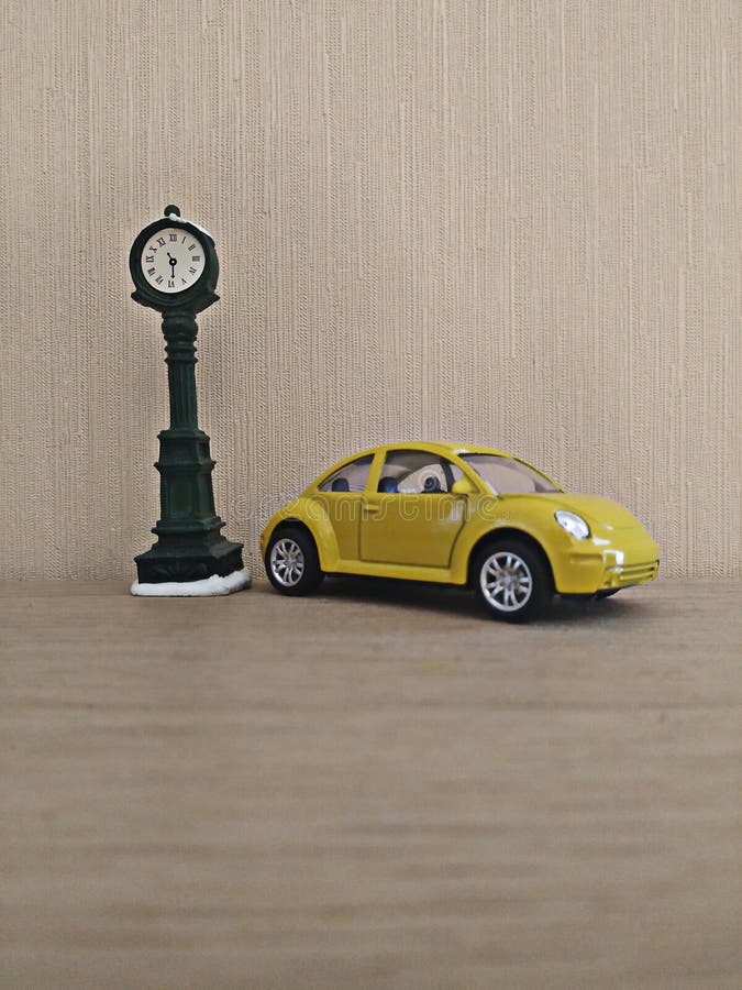 A Nutshell - Beetle Toy Car and a Toy Street Clock Stock Photo - Image ...