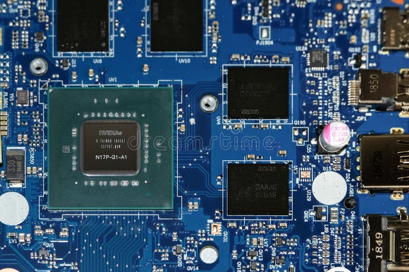 Nvidia GPU Graphics Chip on a Laptop Motherboard. Top Down. Close Up ... Nvidia GPU Graphics Chip on a Laptop Motherboard. Top Down. Close Up ...
