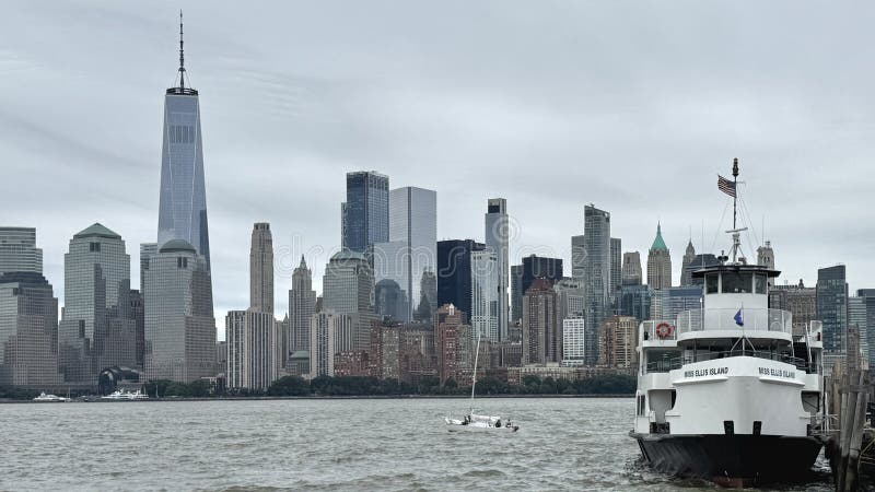 Landscape of Lower Manhattan with Freedom Tower and Ferry in New York ...