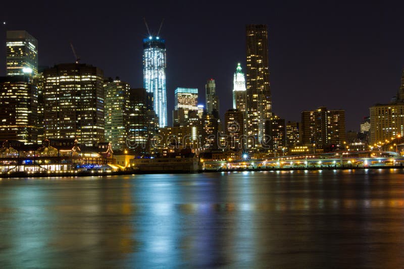 NYC Skyline at night stock image. Image of reflection - 24690291