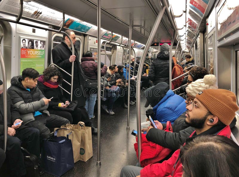 Nyc Subway Train Commuter People Riding Subway Car To Work Crowded City