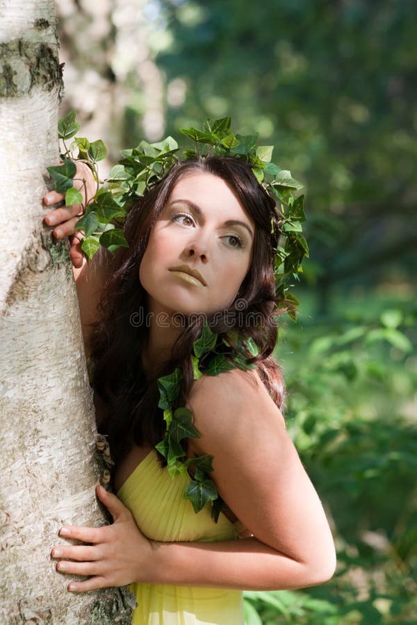 Nymph hugging a tree stock image. Image of forest, care - 10235009
