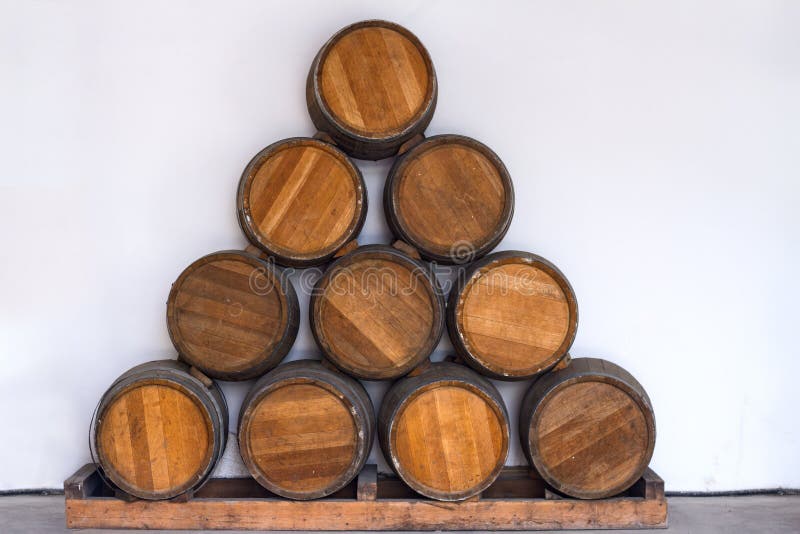 Oak Barrels with Wine Laid Out in the Shape of a Triangle on a White ...