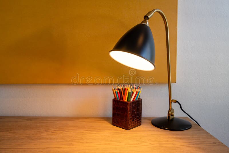 Oak Colored Desk with Lamp and Box of Colored Pencils Stock Image ...