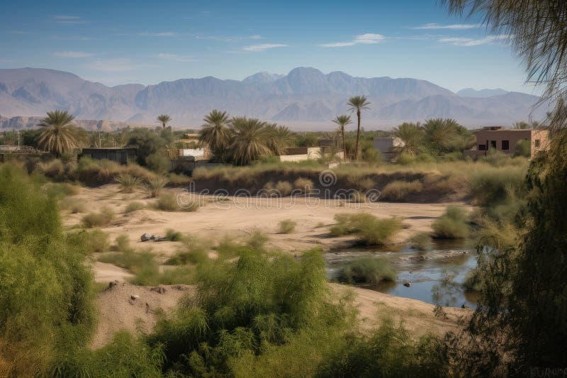 Oasis, Surrounded by Desert with Distant Mountain Range in the ...