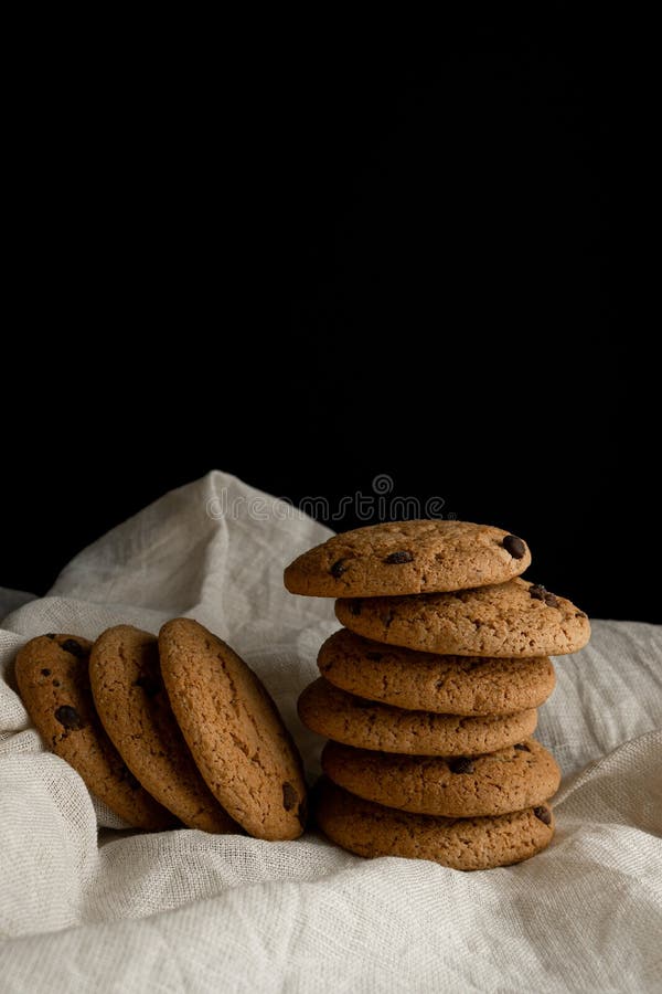Oat Cookies with Pieces of Chocolate on White Cloth Over Black ...