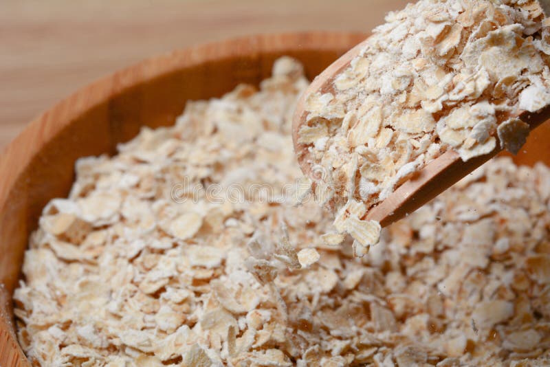Oat Flakes Drop from Wooden Spoon Stock Photo - Image of oats, organic ...