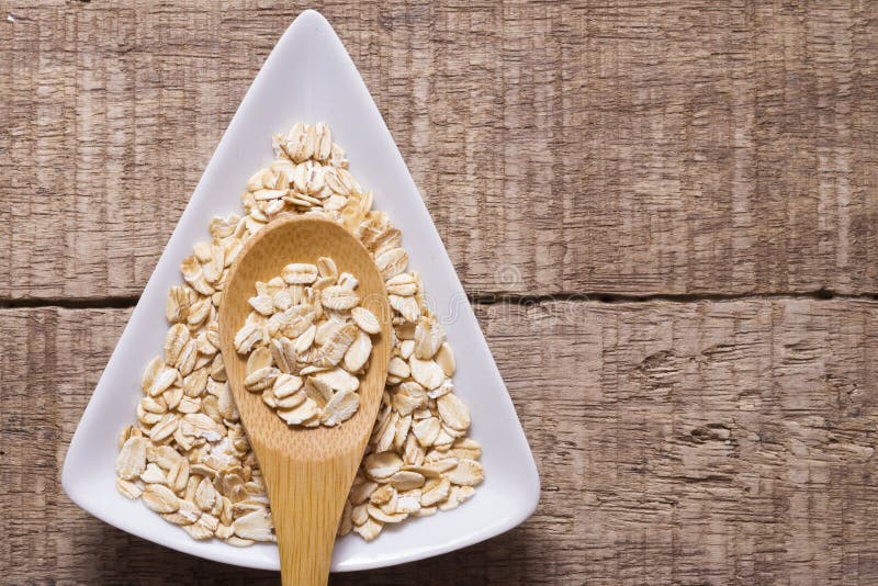 Oat flakes on table stock photo. Image of wheat, natural - 108648092