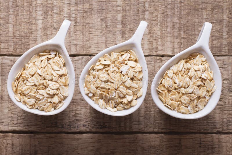 Oat flakes on table stock photo. Image of flake, wheat - 108648386