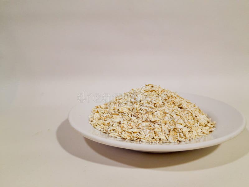 Oat, Oat Grains, Oat Flakes in a White Plate, Isolated on White ...