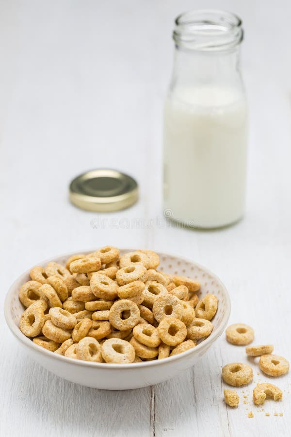 Oat Rings in a Bowl and Milk Bottle Stock Photo - Image of bright ...
