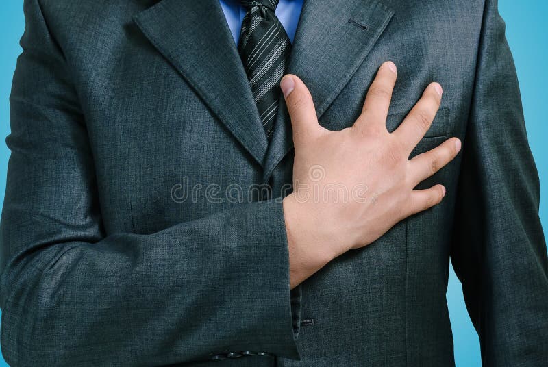Businessman Taking Oath with Fist Over Heart. Stock Image - Image of ...