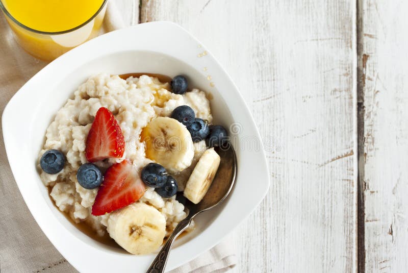 Oatmeal with Berries and Maple Syrup Stock Photo - Image of bowl ...