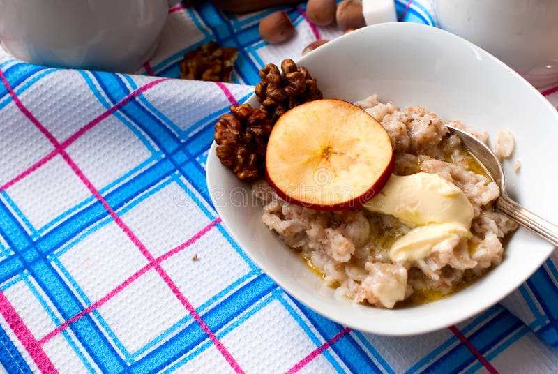 Oatmeal with Butter, Berries and Nuts for Breakfast with Tea Stock ...