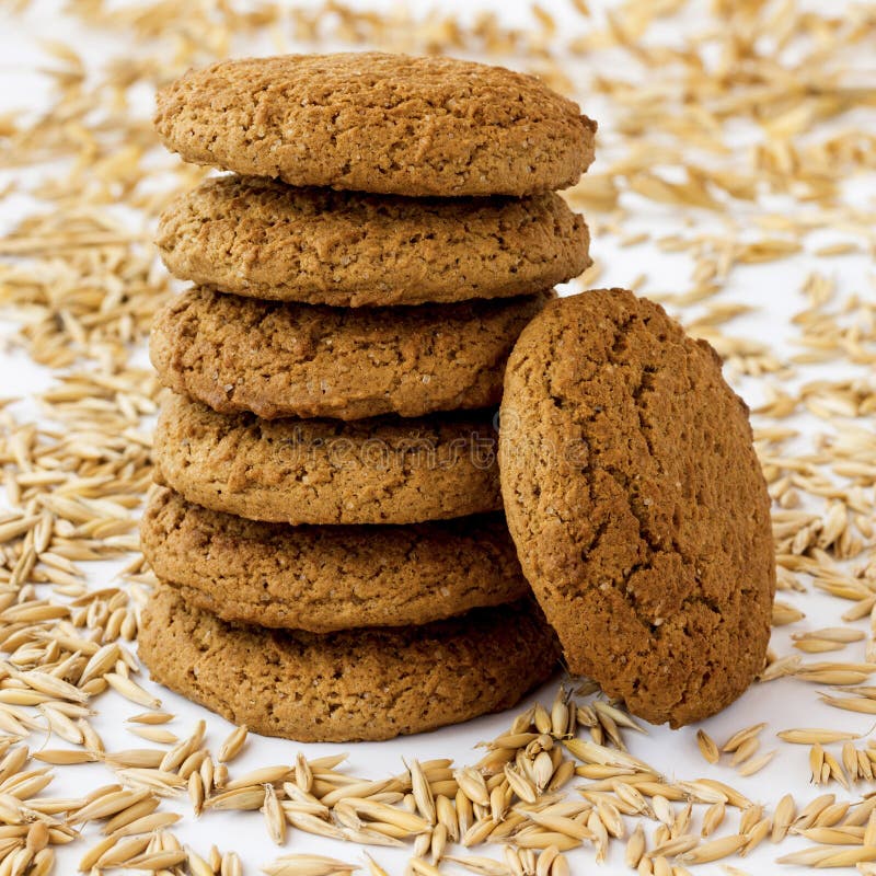 Oatmeal Cookies among Wheat and Oat Grains on a White Background Stock ...