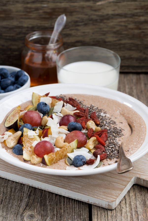Oatmeal with Fresh Fruit, Nuts and Chia for Breakfast, Vertical Stock ...