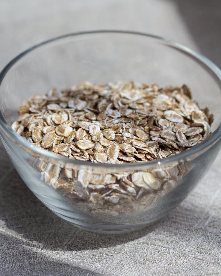 Oatmeal in a glass bowl stock image. Image of plate - 162068349