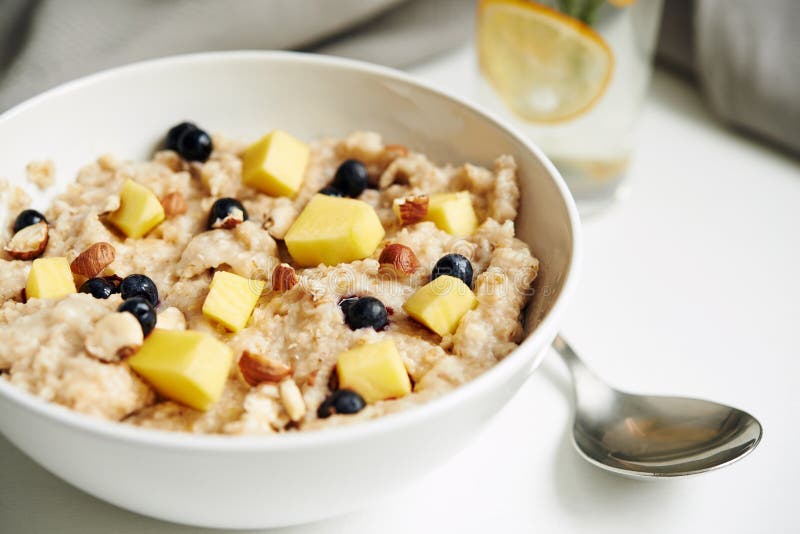 Oatmeal with Mango and Berries Stock Photo - Image of bowl, cereal ...