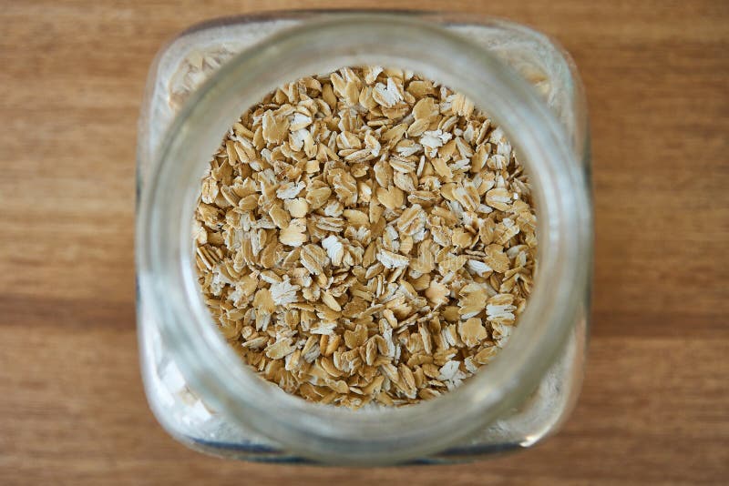 Oats in a Glass Jar with a Spoon, Closeup Stock Image - Image of ...