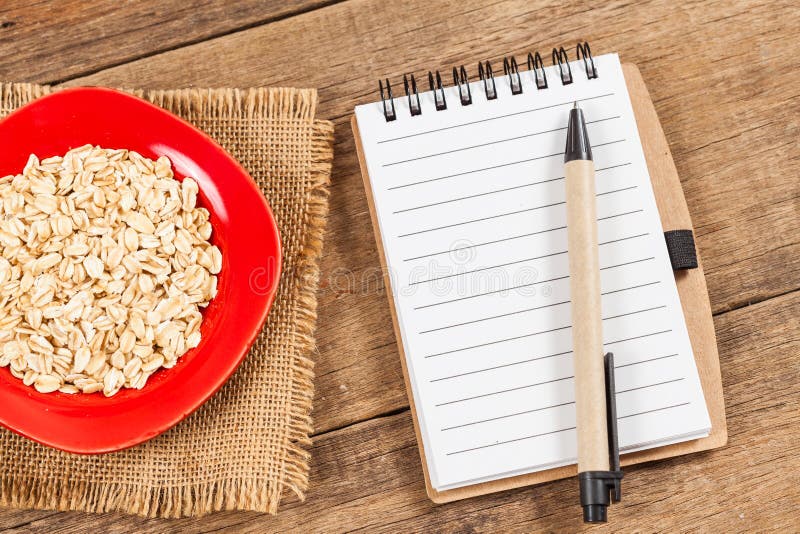 Oats in plate on wood stock image. Image of ingredient - 77333125