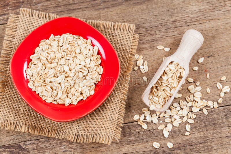 Oats in plate on wood stock photo. Image of healthy, angle - 77333232