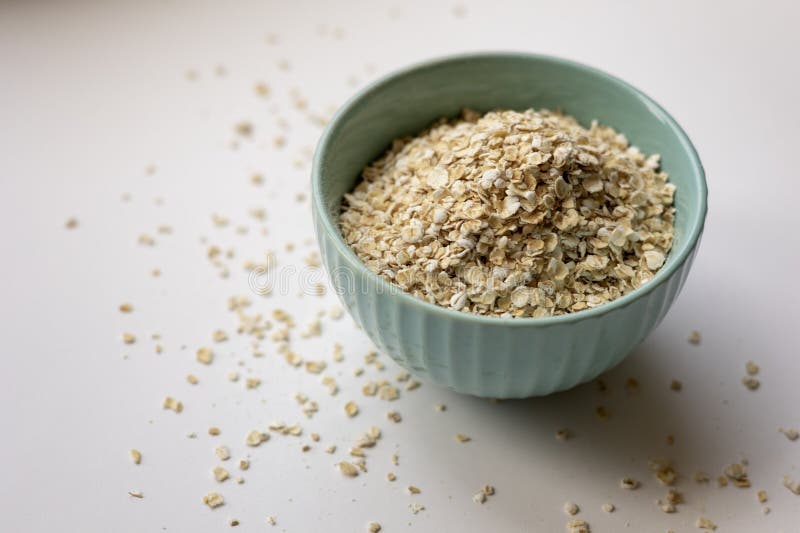 Oats in a Small Blue Bowl Isolate on White Background Closeup Stock ...