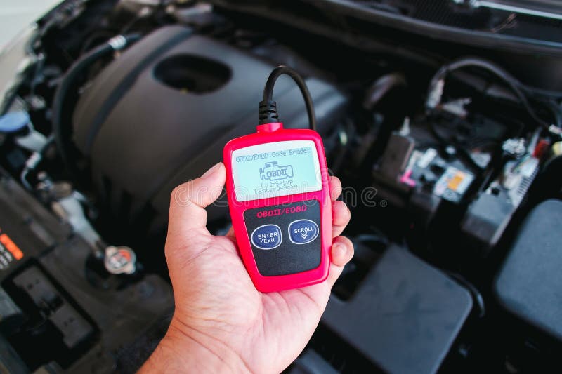 OBD2 or OBD Scanner in a Auto Mechanic Hand for Engine System Analysis ...