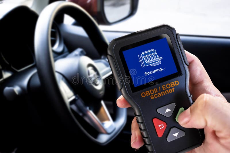 OBDII Scanner in Use by Auto Mechanic for Reading Fault Code of the Car ...