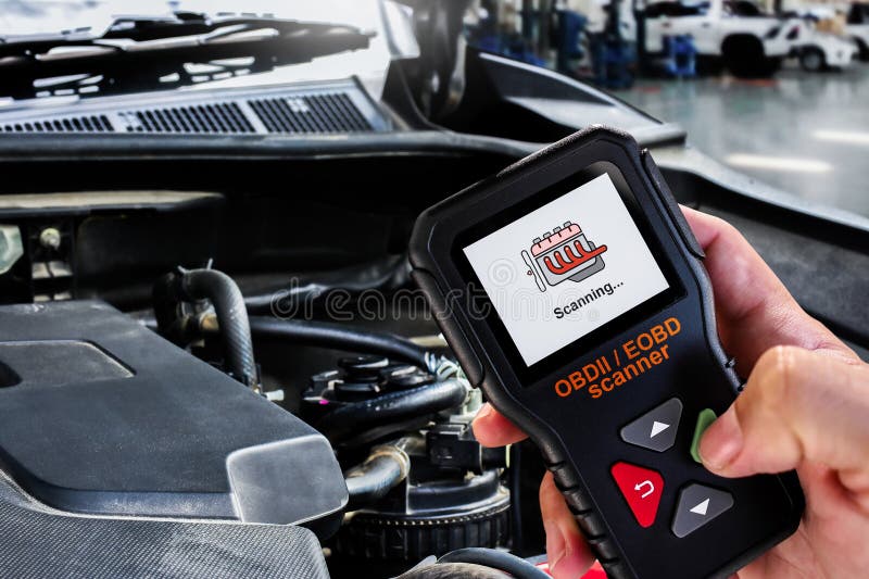 Auto Mechanic Checking ECU Engine System with OBD2 Wireless Scanning ...