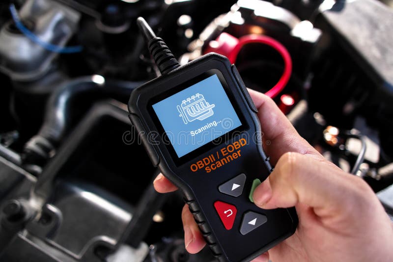OBDII Scanner in Use Under the Hood by Auto Mechanic for Reading Fault ...