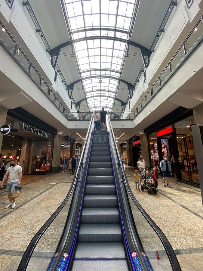 View Inside Modern Shopping Mall with Escalator and Bright Light from ...