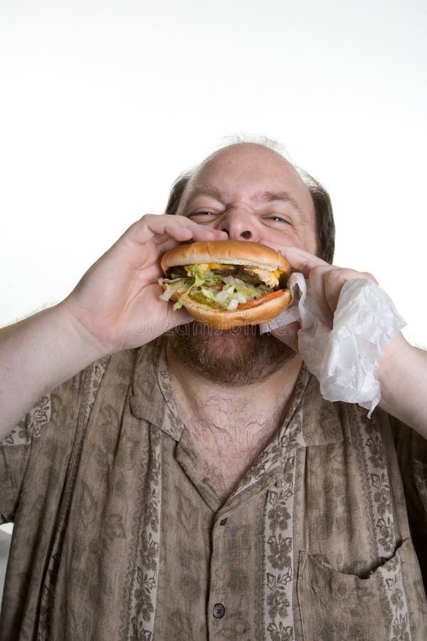Obese man eating fast food stock photo. Image of eating - 21950478