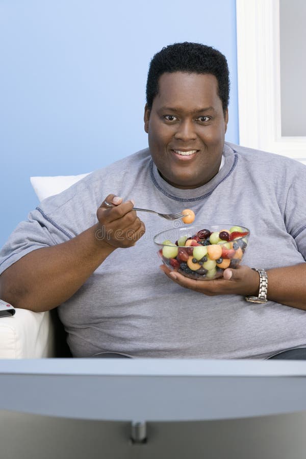 Obese Man Eating Fruits stock photo. Image of obese, heavy - 29651996