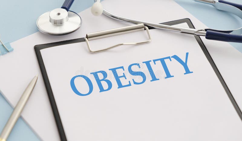 OBESITY Text on White Paper on the White Background. Stethoscope Stock ...