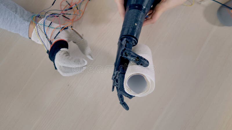 An Object is Being Lifted by Bionic Arm. 4K. Stock Video - Video of ...
